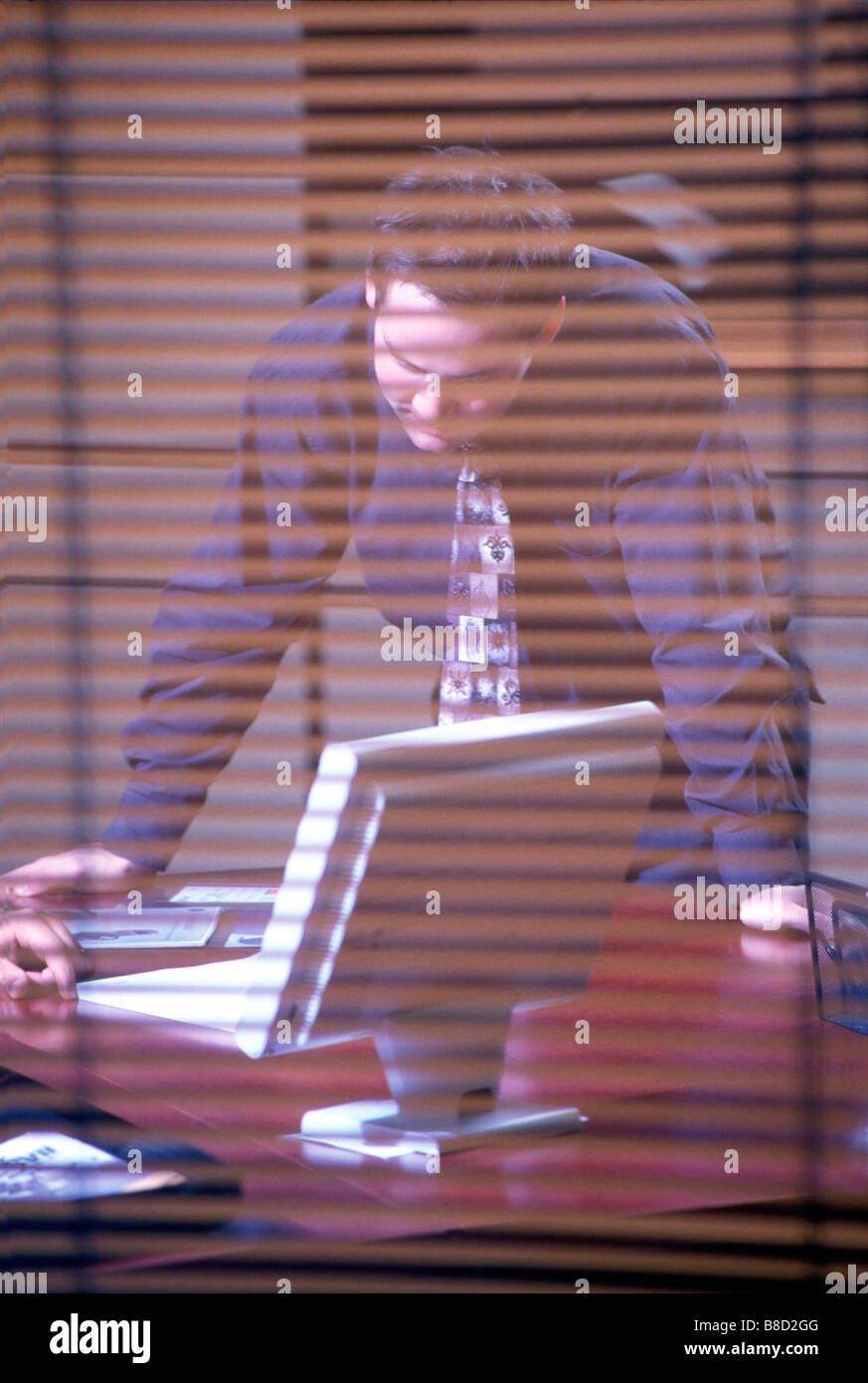 FV3106, Mad Cow Studio; Man fice Desk, Seen Through Blinds Stock Photo ...