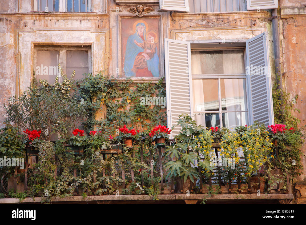 Balcony and window with flowers, Rome, Italy Stock Photo - Alamy