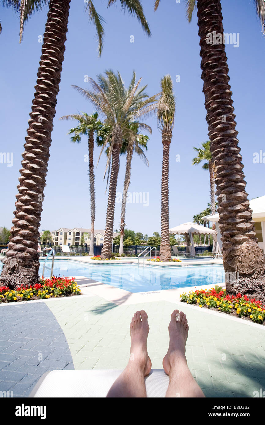 Legs of person resting by the swimming pool, Jacksonville, Florida ...