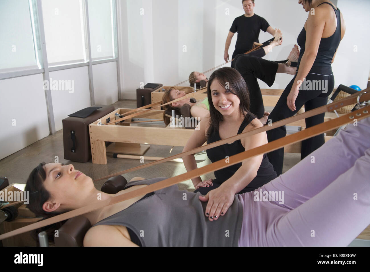 Instructors Teaching Pilates Class Stock Photo - Alamy