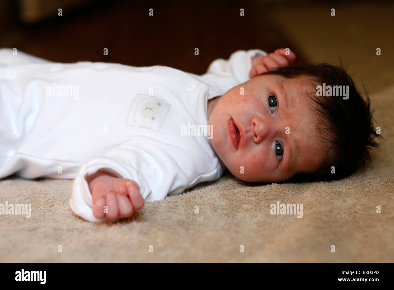 A newborn baby lying on it s back Stock Photo - Alamy