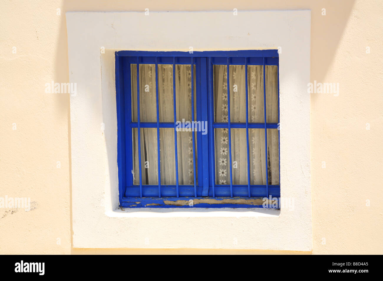 Blue painted window in Kefalonia Greece Stock Photo - Alamy
