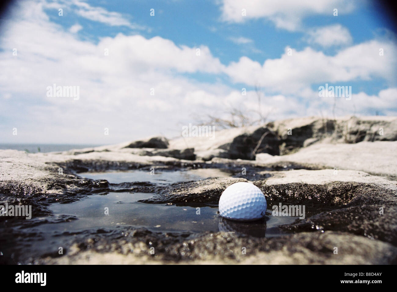 Golf Ball Water Rocks Stock Photo - Alamy