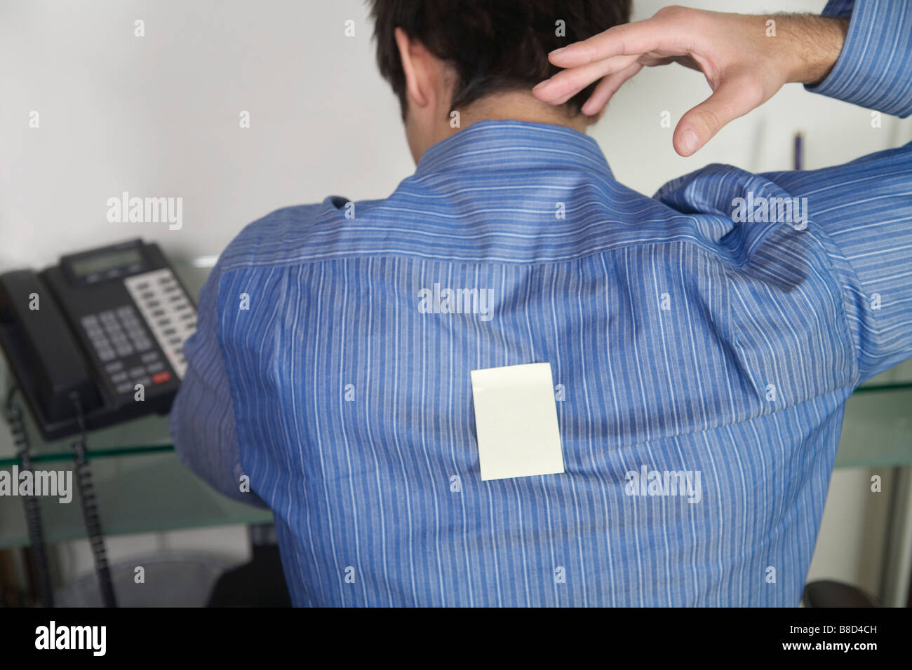 Office Worker Sticky Note his Back Stock Photo - Alamy