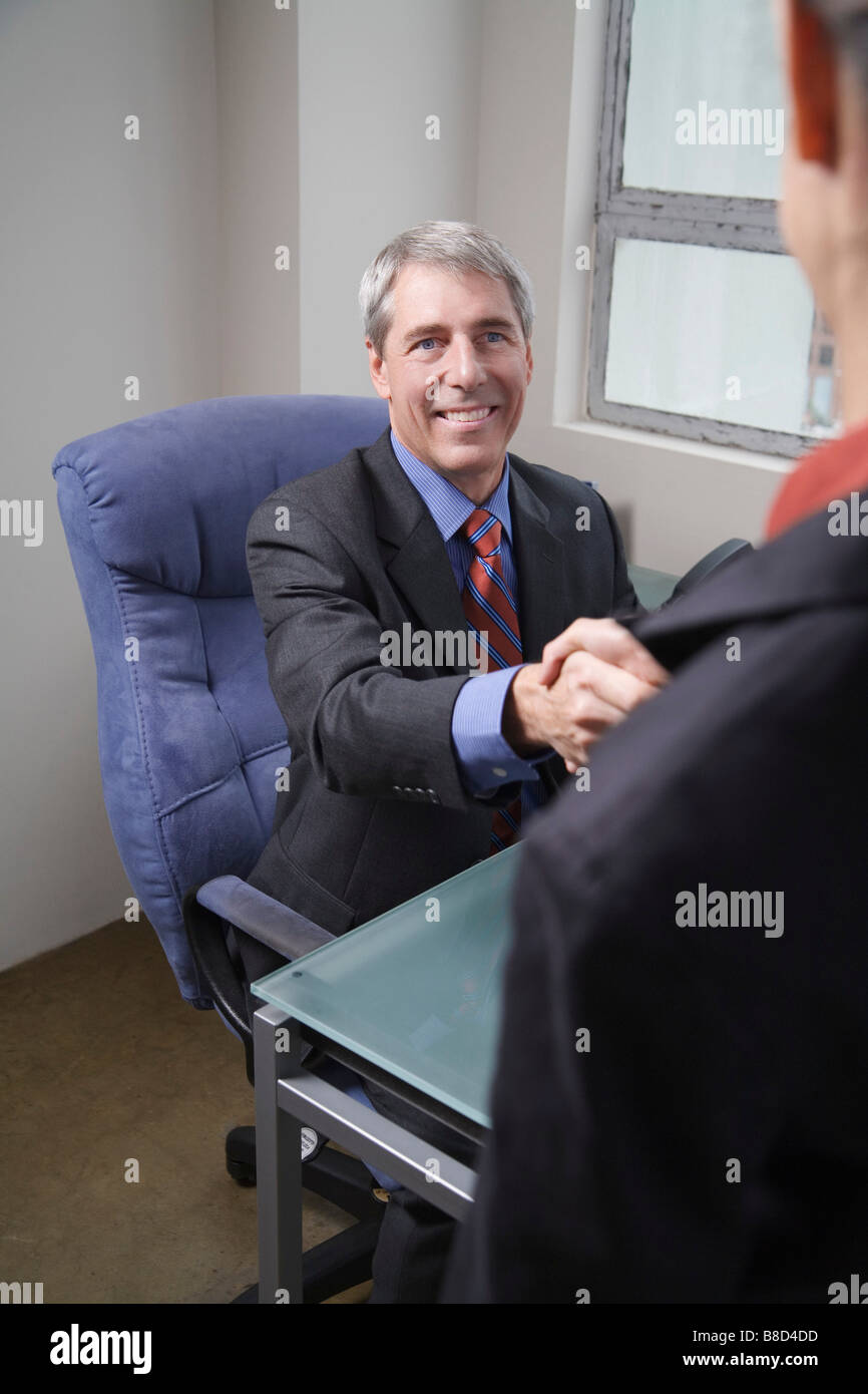 Male her fice Workers Shaking Hands Stock Photo - Alamy
