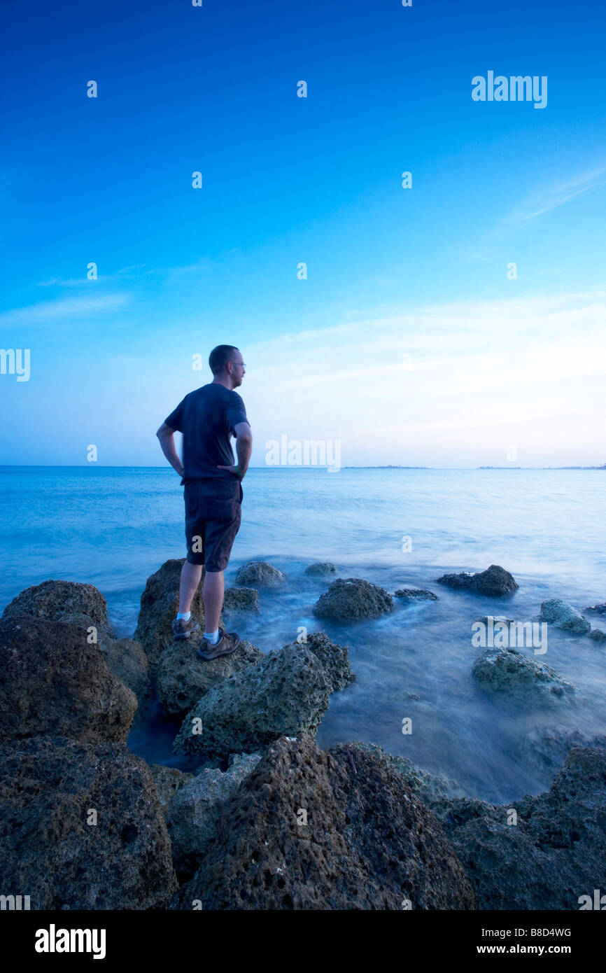Man Rocks Ocean, Early Morning Sunrise, Cable Beach, Bahamas Stock ...