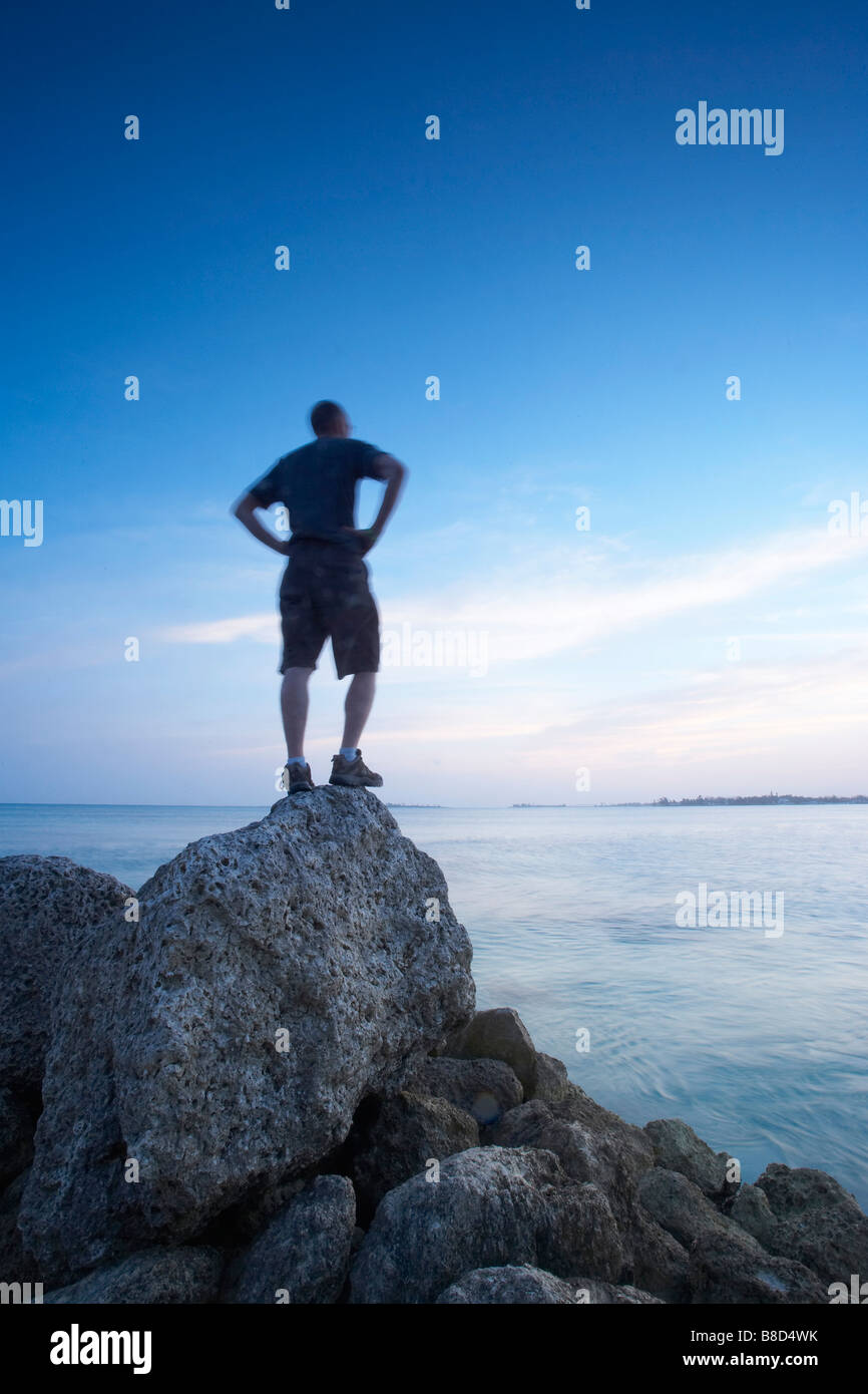 Man Rocks Ocean, Early Morning Sunrise, Cable Beach, Bahamas Stock ...