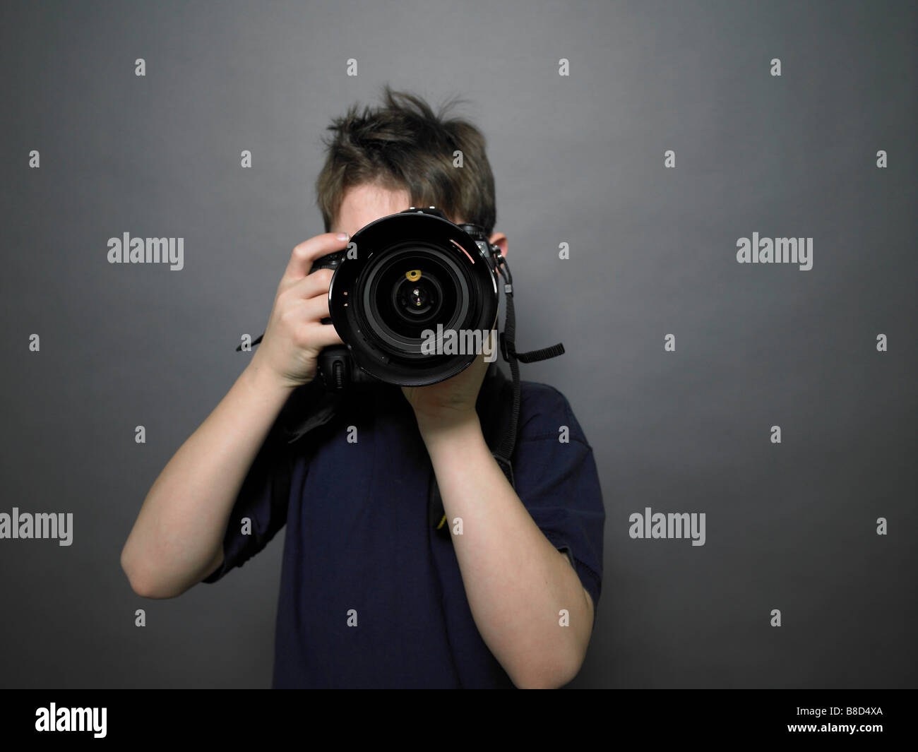 Young boy Using Camera Stock Photo - Alamy