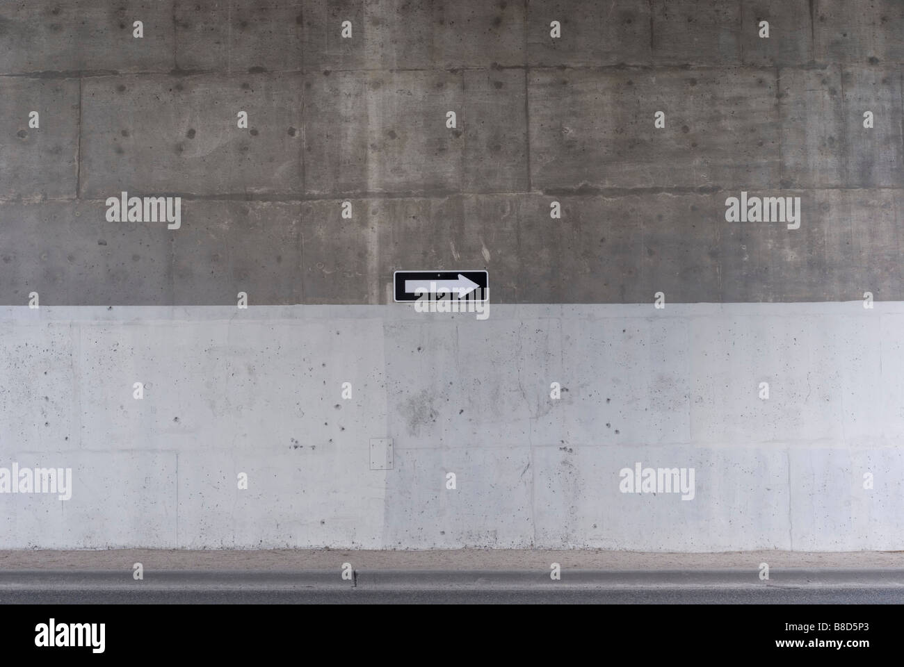 One Way Road Sign Concrete Wall, Vancouver, British Columbia Stock ...