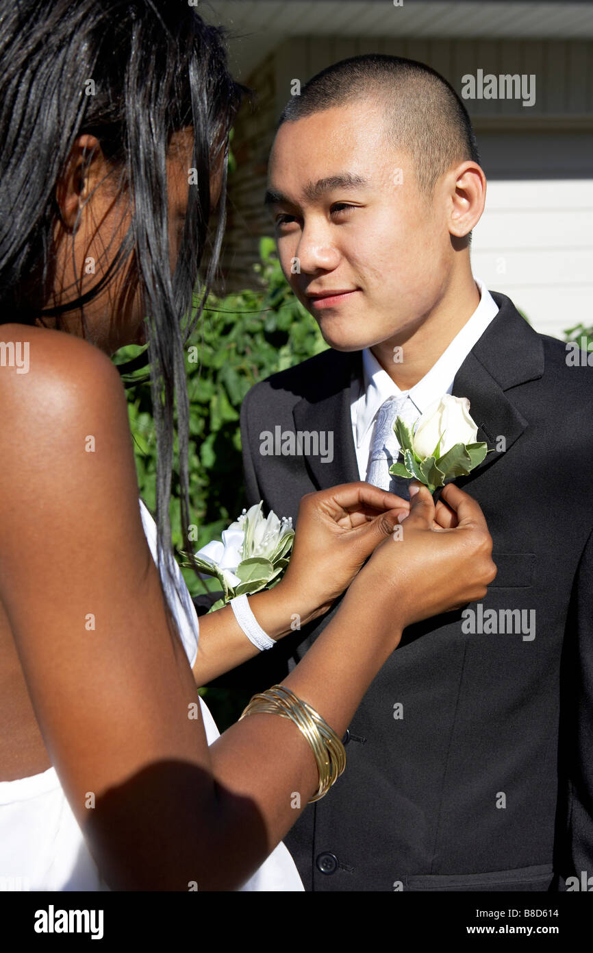 Girls Pinning Flower High Resolution Stock Photography and Images - Alamy