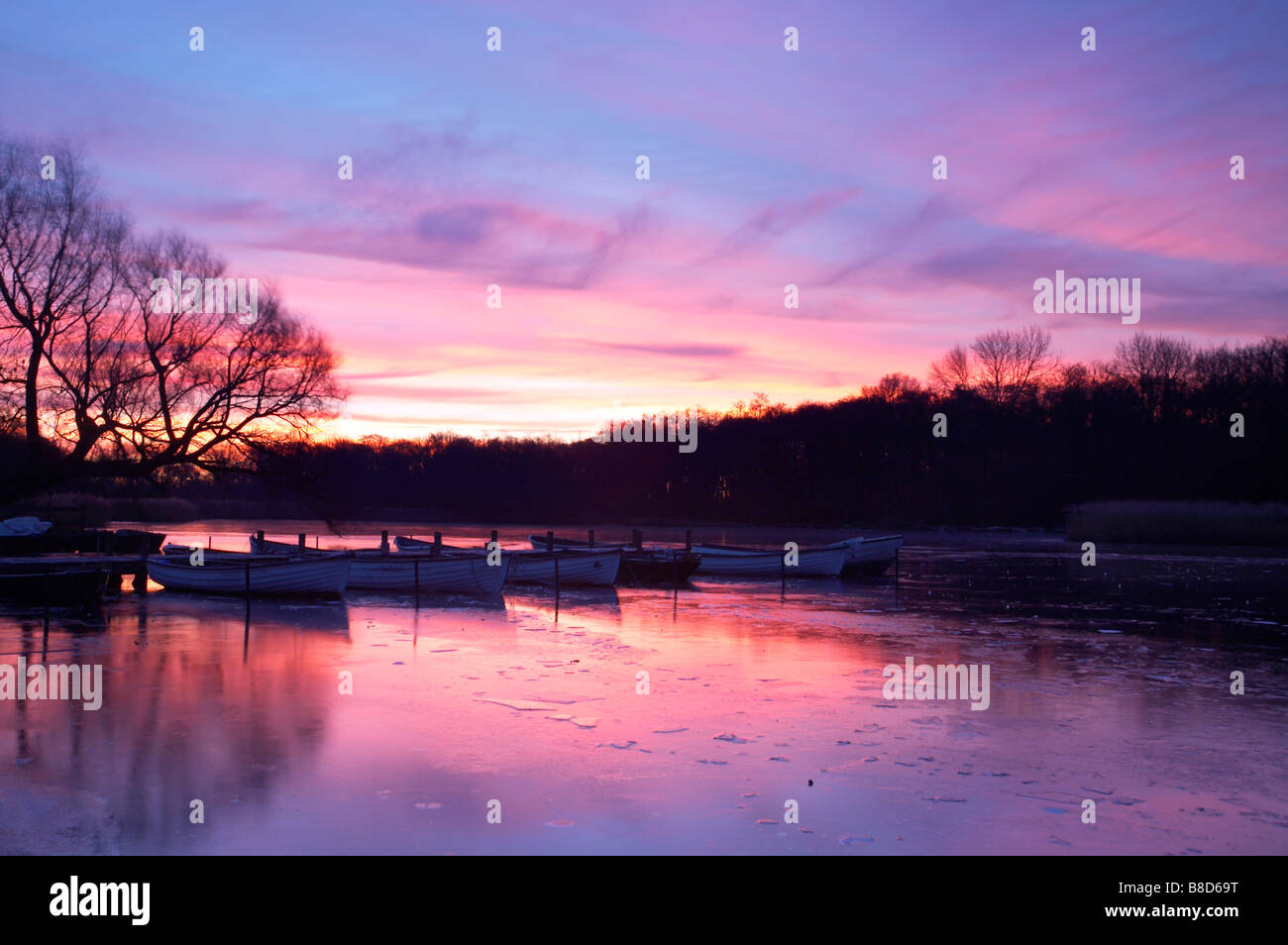 A winter sunrise over a frozen Ormesby Broad on the Norfolk & Suffolk ...