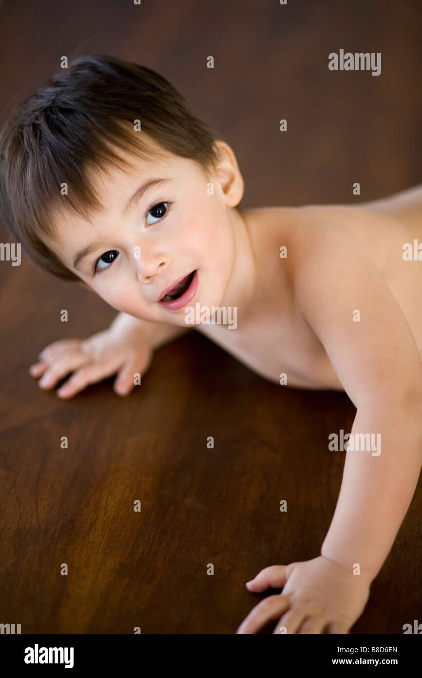 Boy Crawling Hardwood Floor Stock Photo - Alamy
