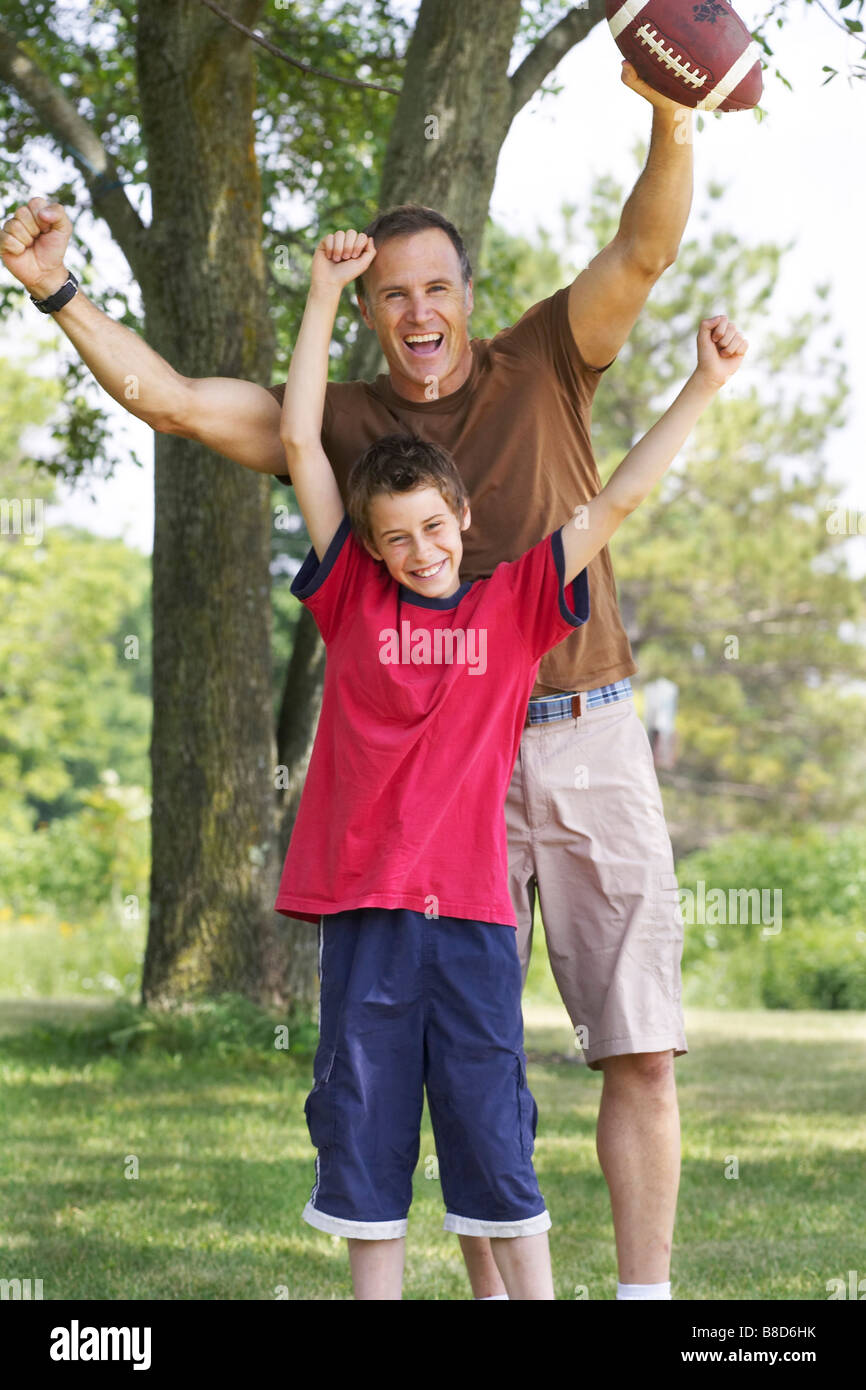 Father Son Cheering after Football Touchdown Stock Photo - Alamy