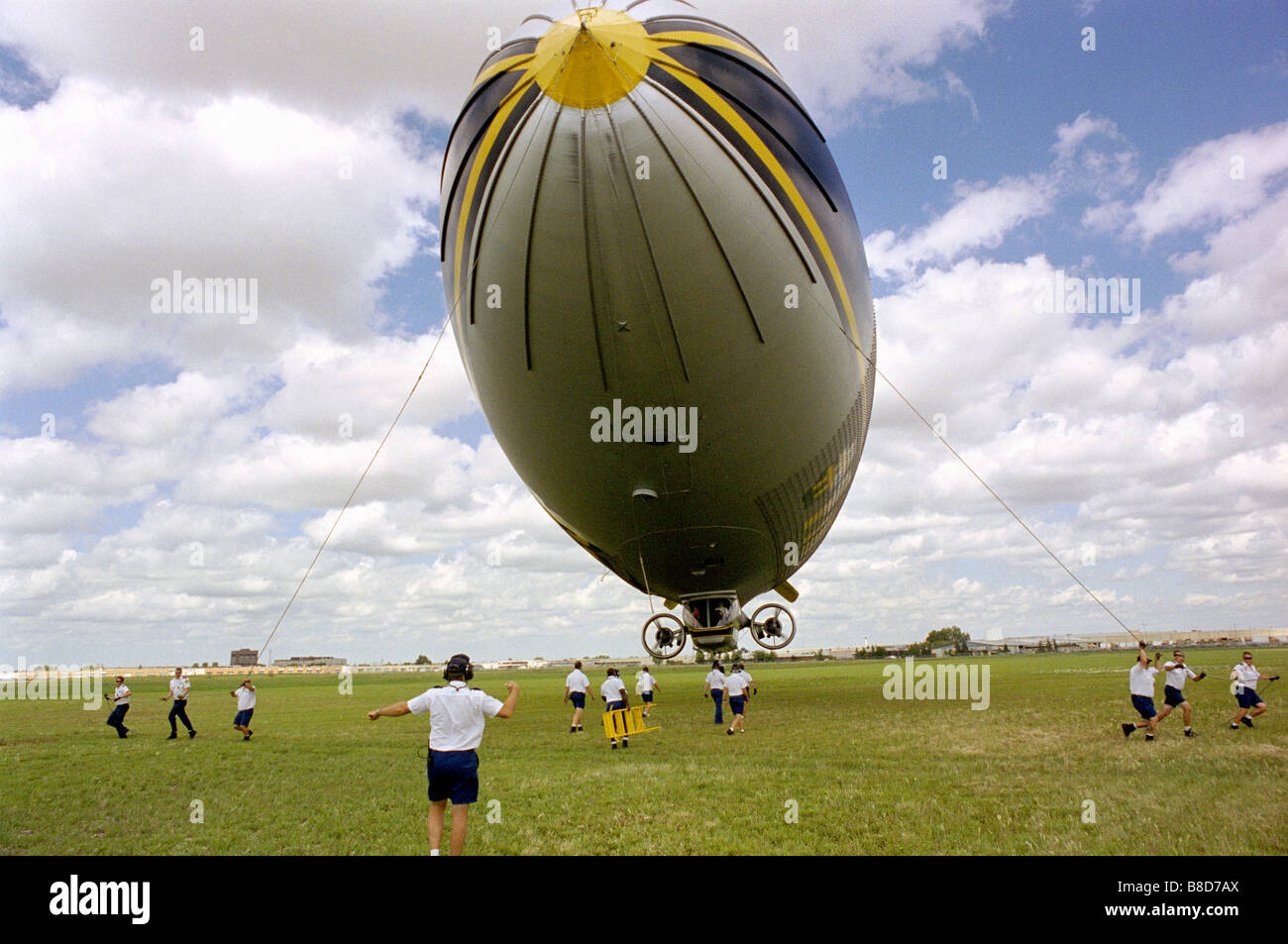 Ground Crew Stabilizes Goodyear Blimp to provide Aerials Coverage Pan ...
