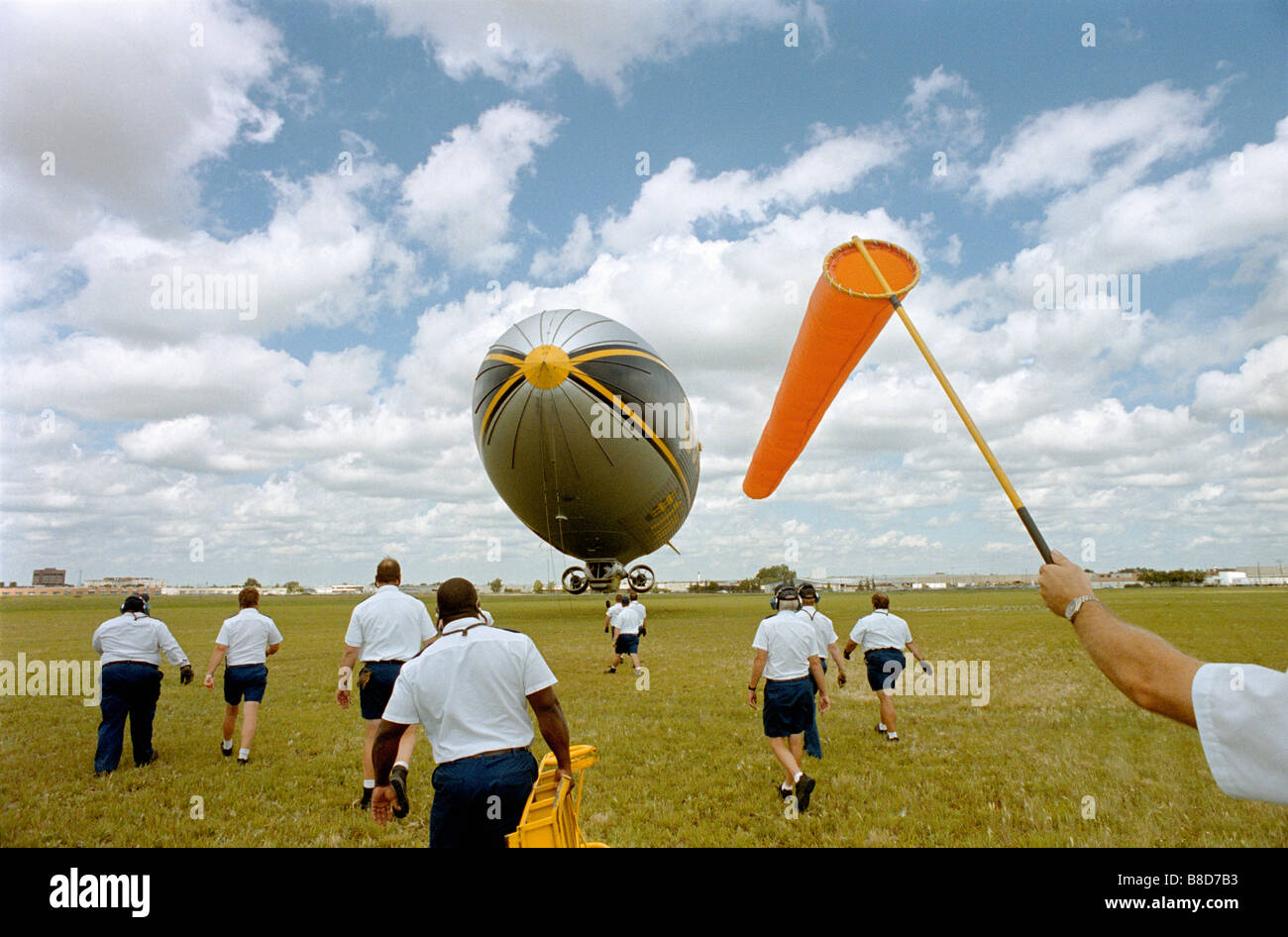 Ground Crew Stabilizes Goodyear Blimp to provide Aerials Coverage Pan ...