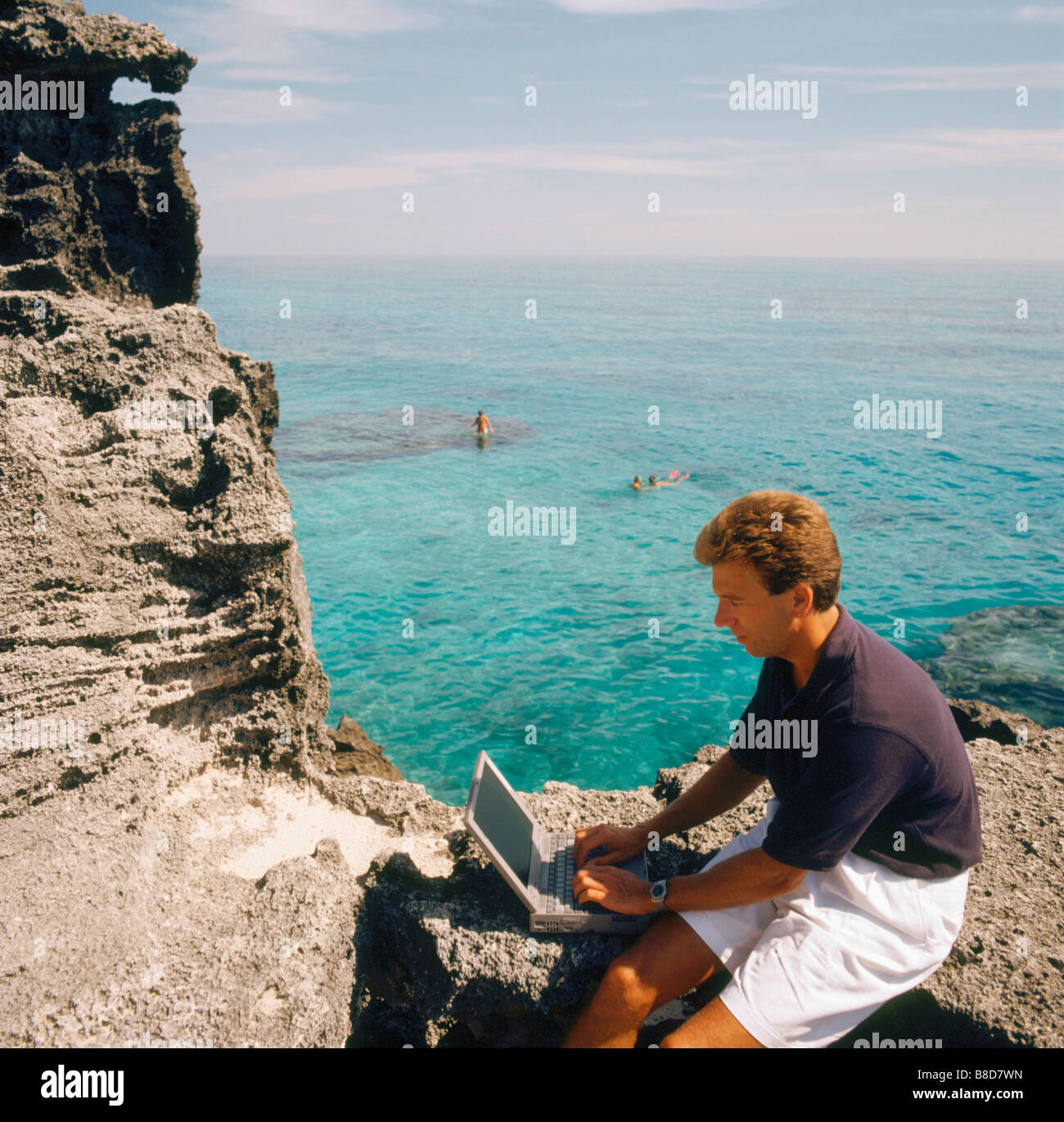 Man Laptop by Ocean, Bermuda Stock Photo - Alamy