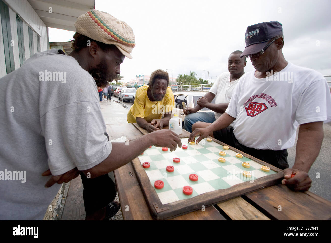 Group Locals Playing Checkers, Nassau, Bahamas Stock Photo - Alamy