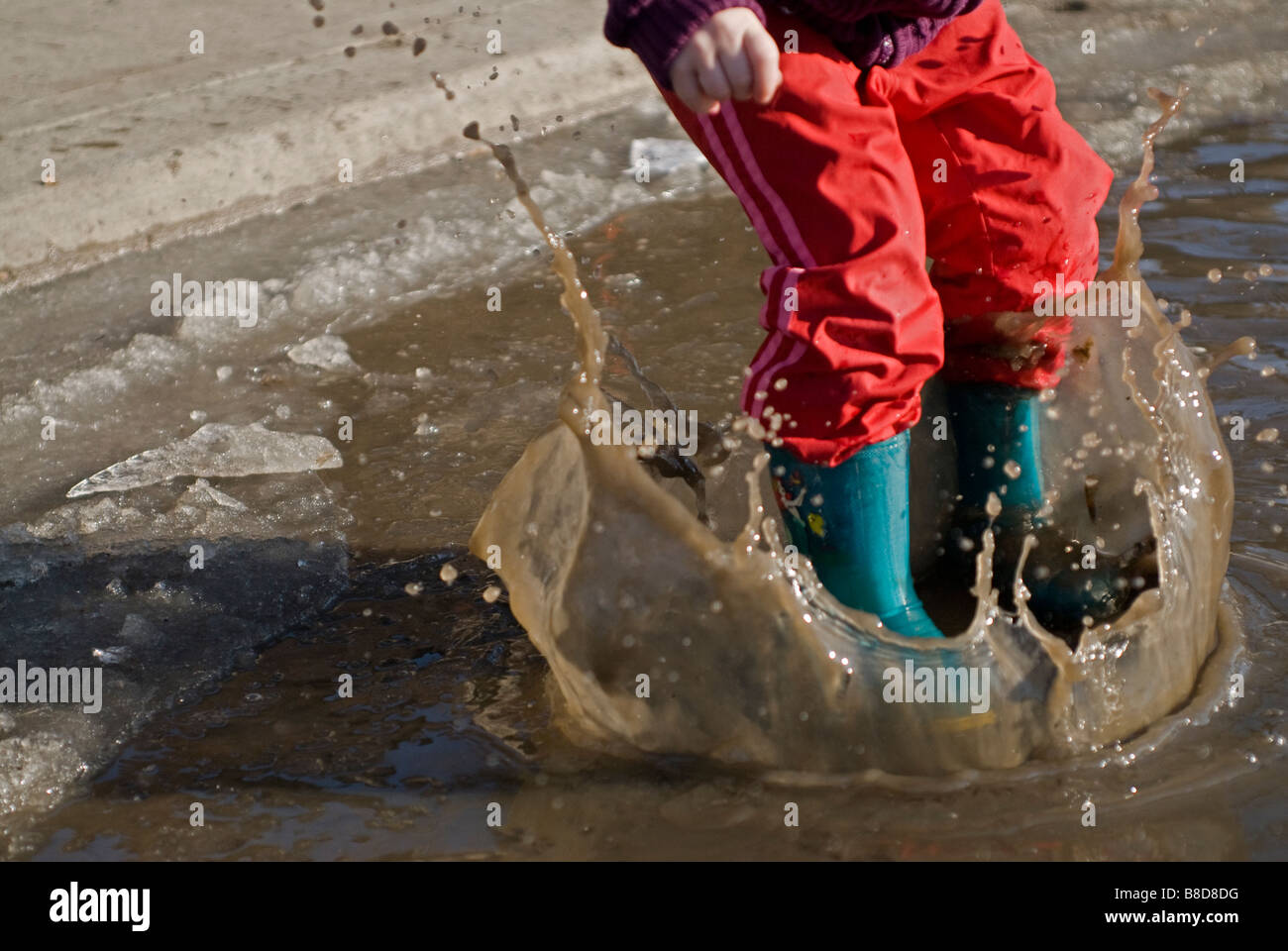Child Jumping Puddle Stock Photo - Alamy