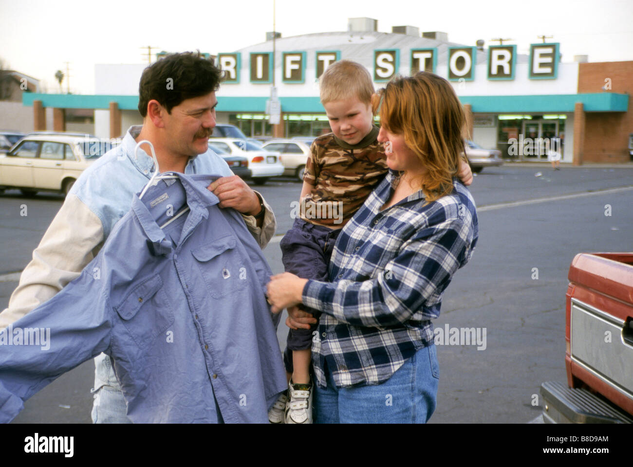 Husband of poor family shows wife shirt he just bought at thrift store ...