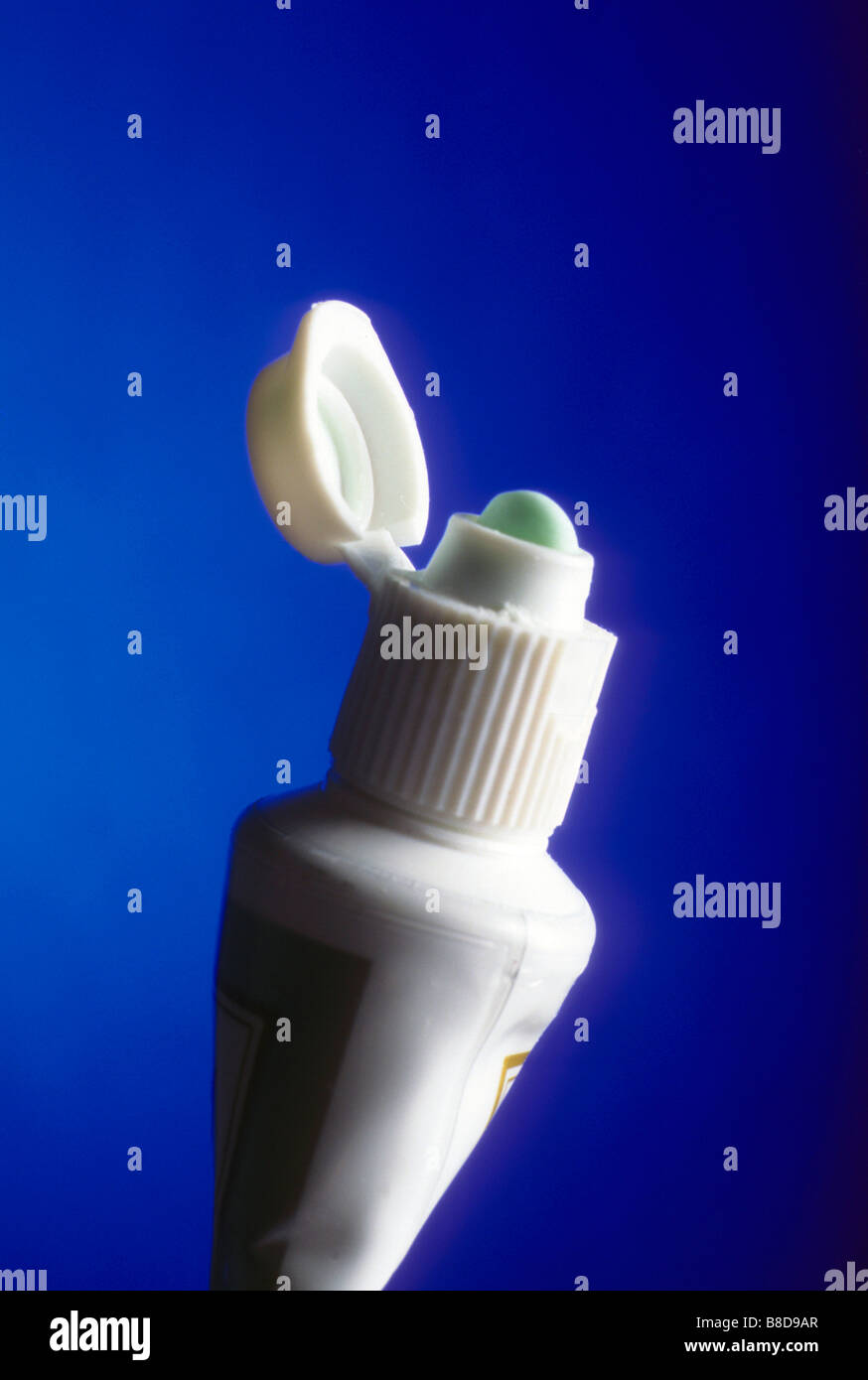 Toothpaste squeezes out of tube Stock Photo - Alamy