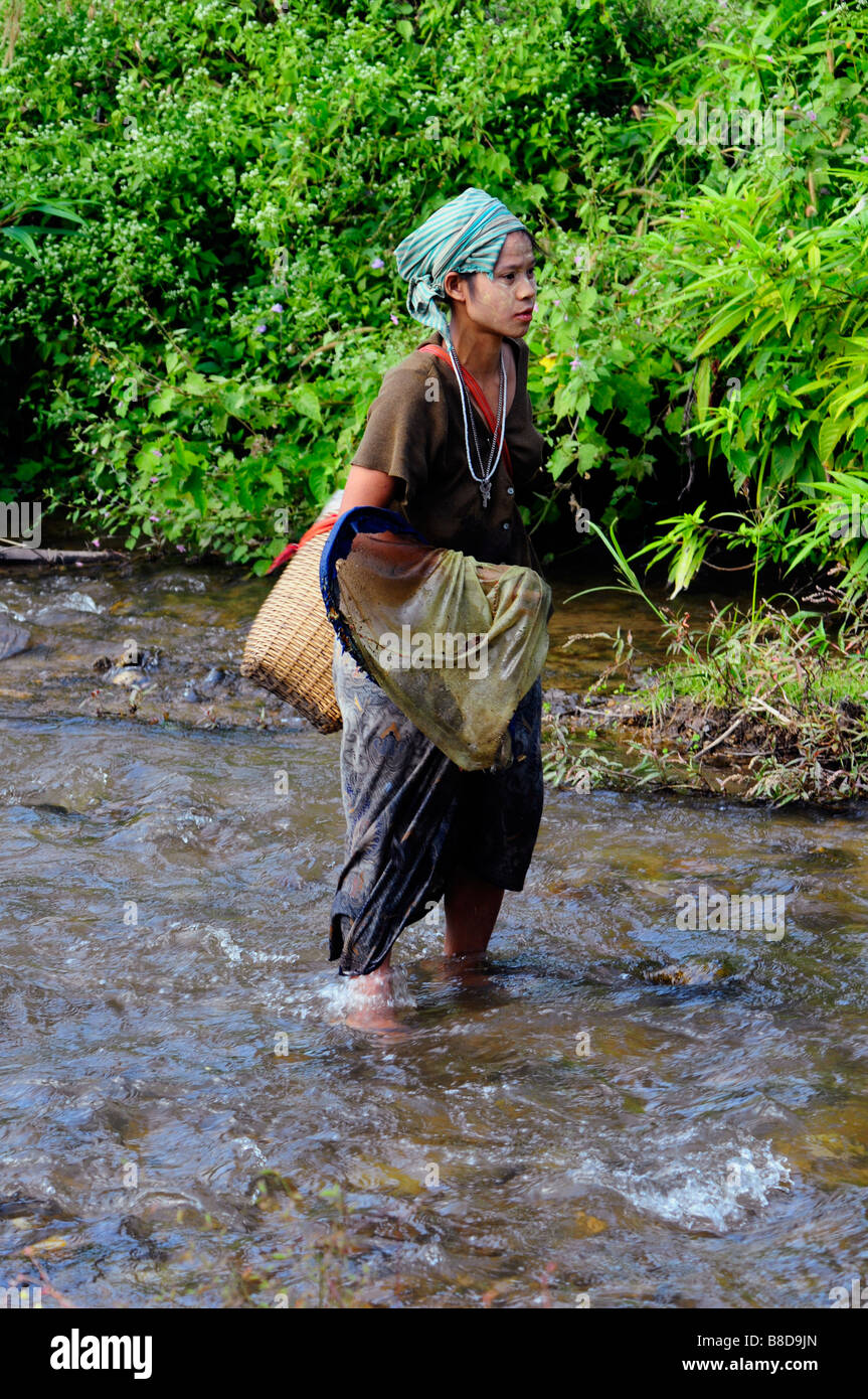 Refugee girls is catching fish and prawn in the river outside Maela ...