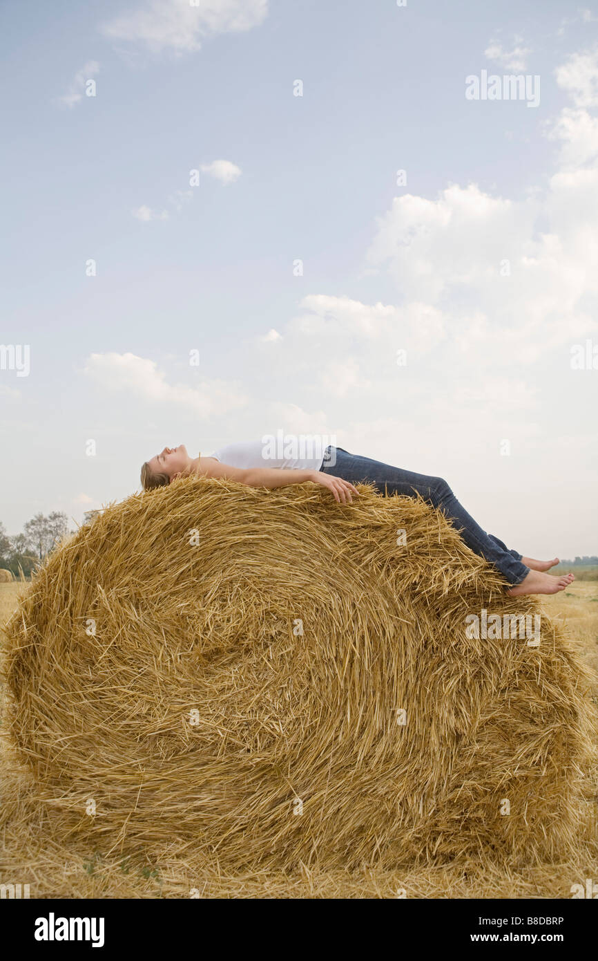 Young woman sleeping in hay hi-res stock photography and images - Alamy