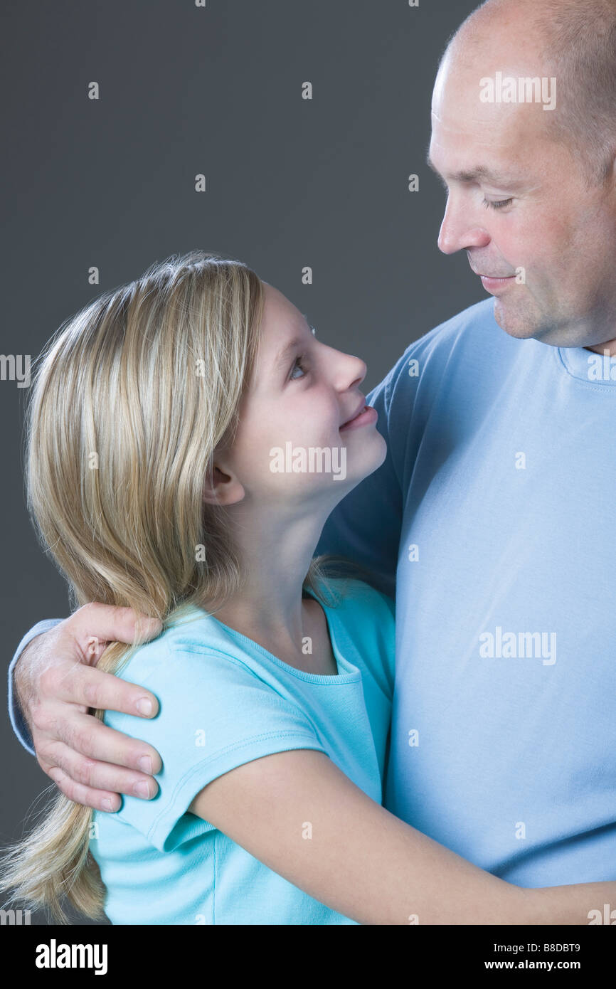 Man and hugging teen daughter hi-res stock photography and images - Alamy