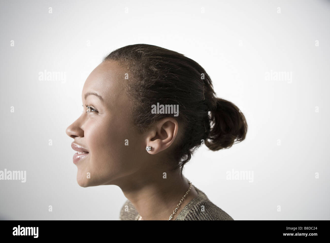 Young woman smiling, profile, close-up view Stock Photo - Alamy