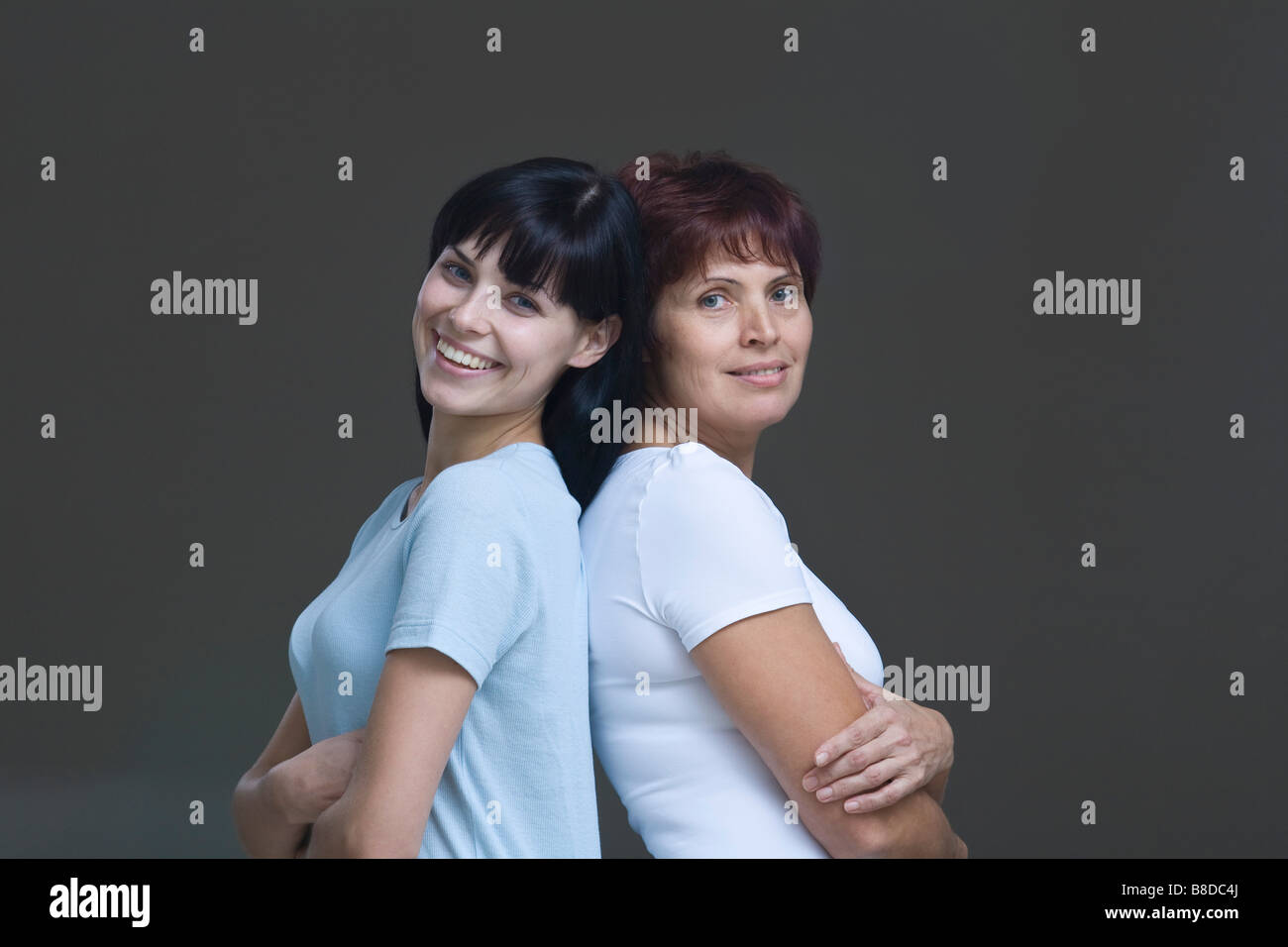 Woman daughter standing back crossed hi-res stock photography and ...