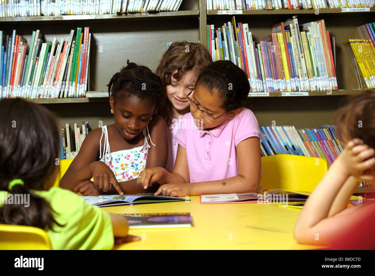 Little Girls School Library Stock Photo - Alamy