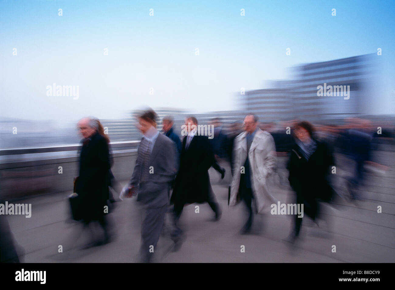 commuters on the way to work on London Bridge, City of London, England ...