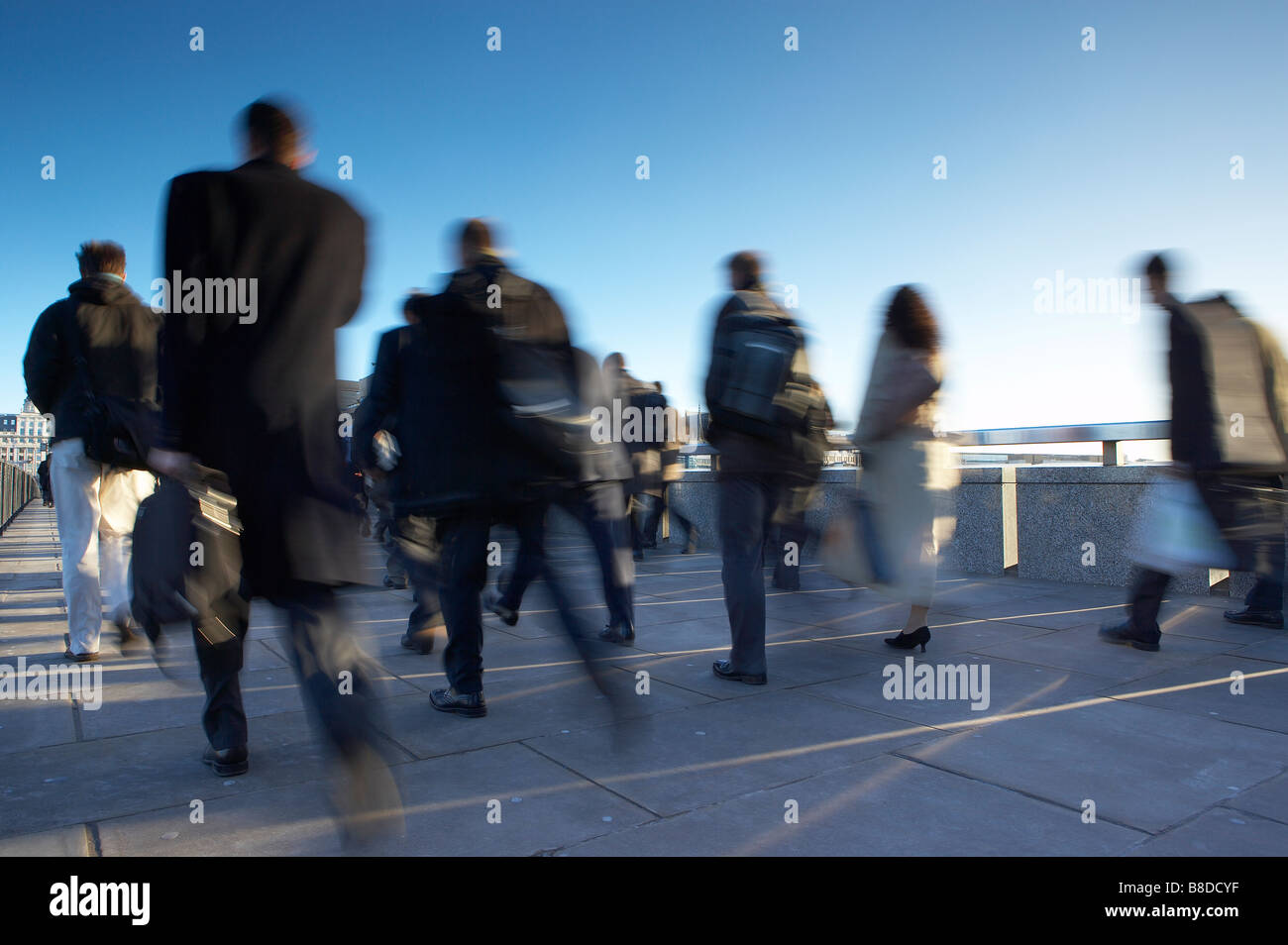 the trudge to work, commuters crossing London Bridge on the way to work ...