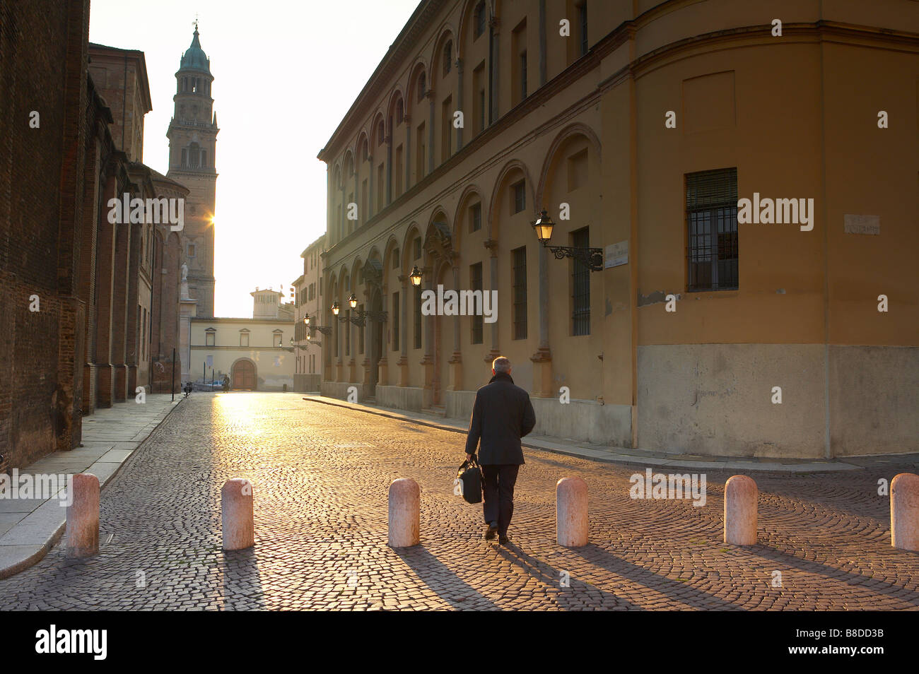 a man walking down Via Cardinal Ferrari with Piazzale San Giovanni ...