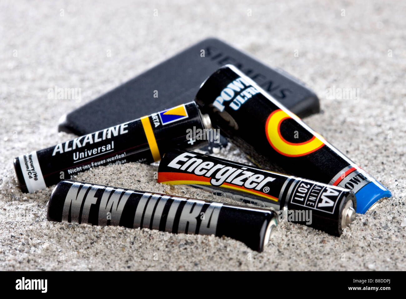 Battery waste on the beach Stock Photo - Alamy