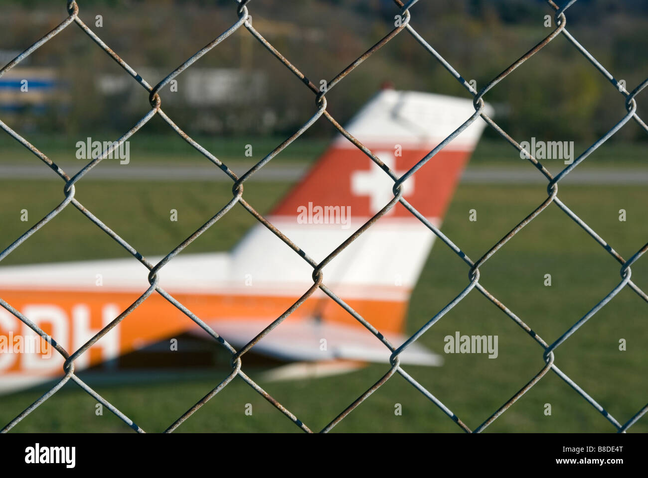 swiss airplane behind the net Stock Photo - Alamy