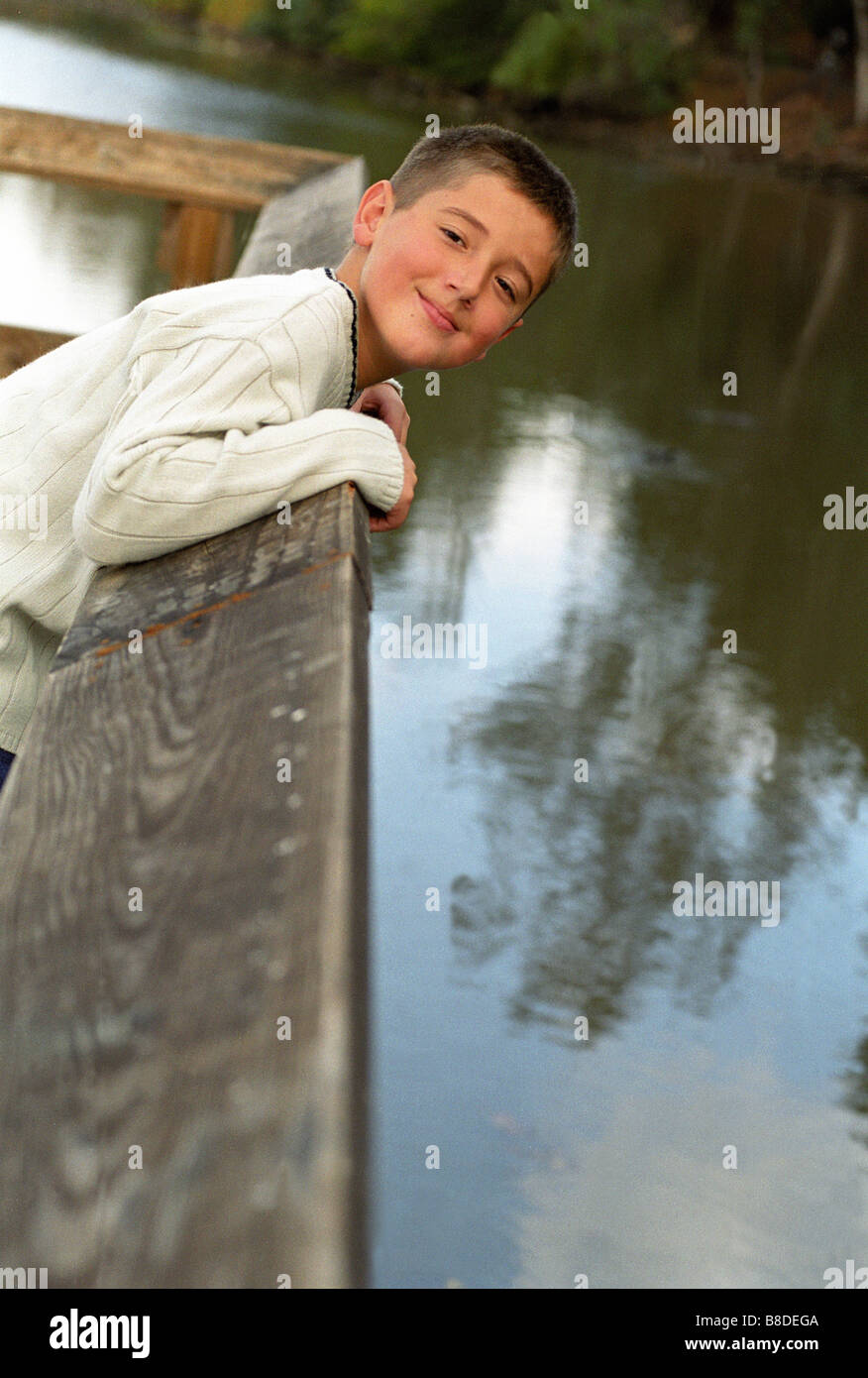 Child leaning over railing hi-res stock photography and images - Alamy