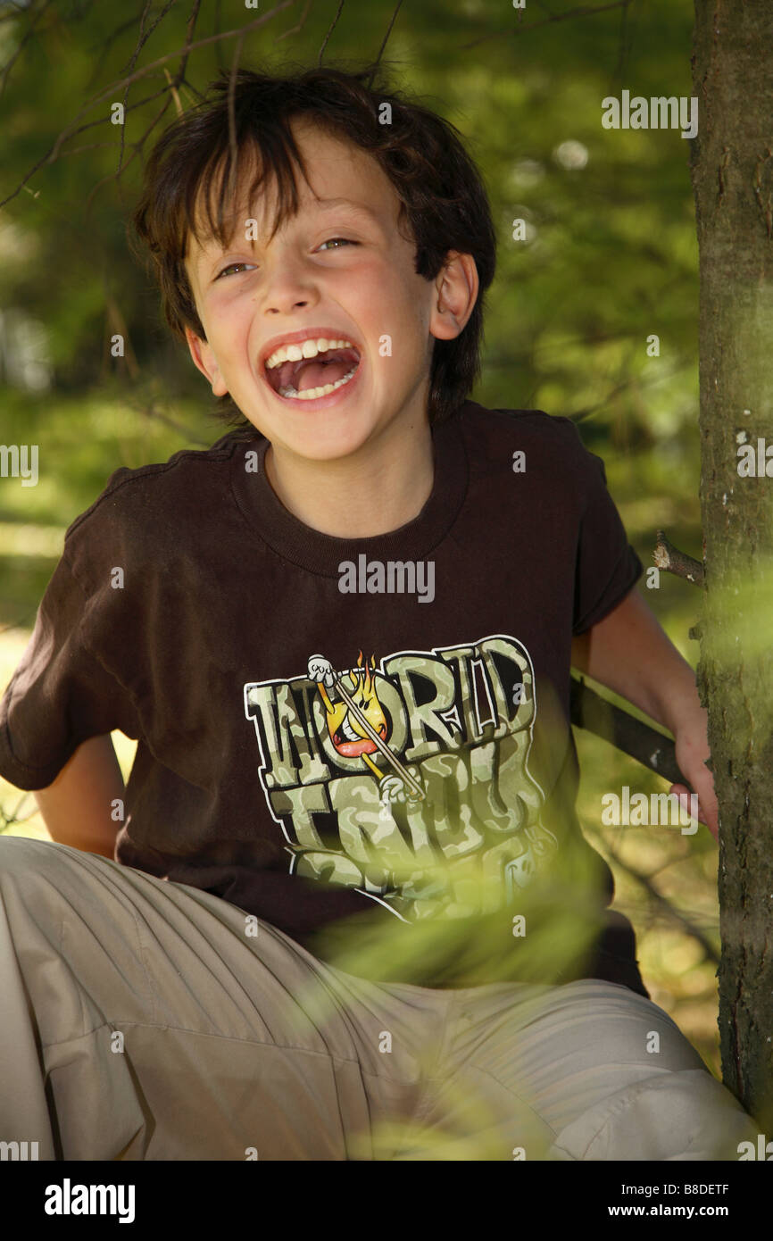 Little Boy Sitting Tree Stock Photo - Alamy