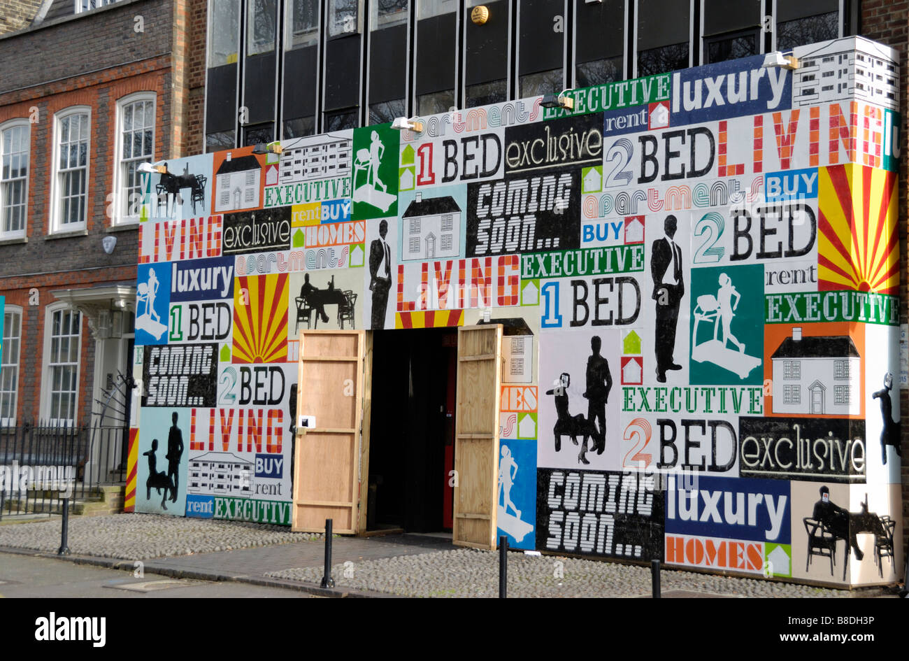 Large colourful billboard advertising luxury 1 and 2 bed apartments ...