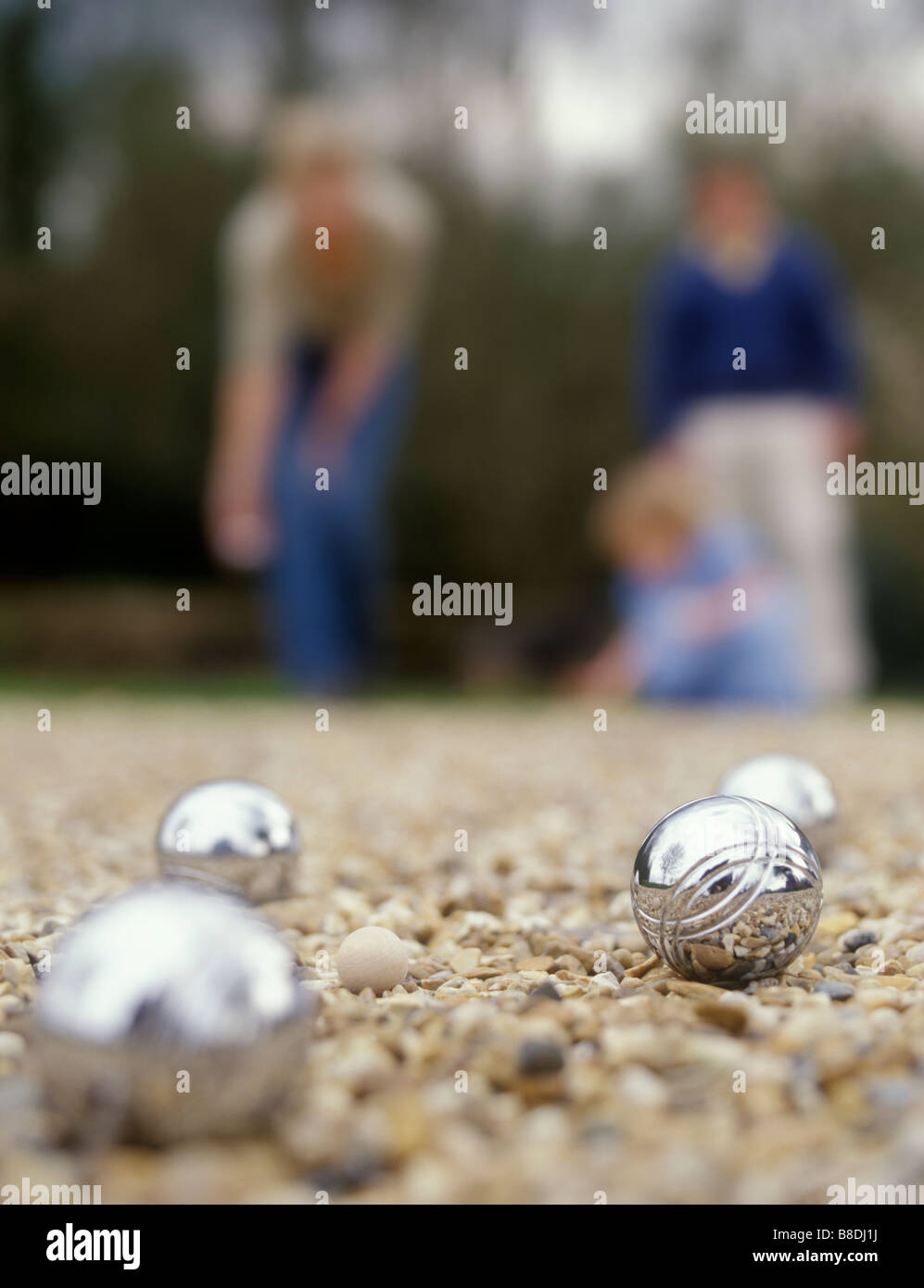 a game of boule in the French summer with p layers throwing the boules ...