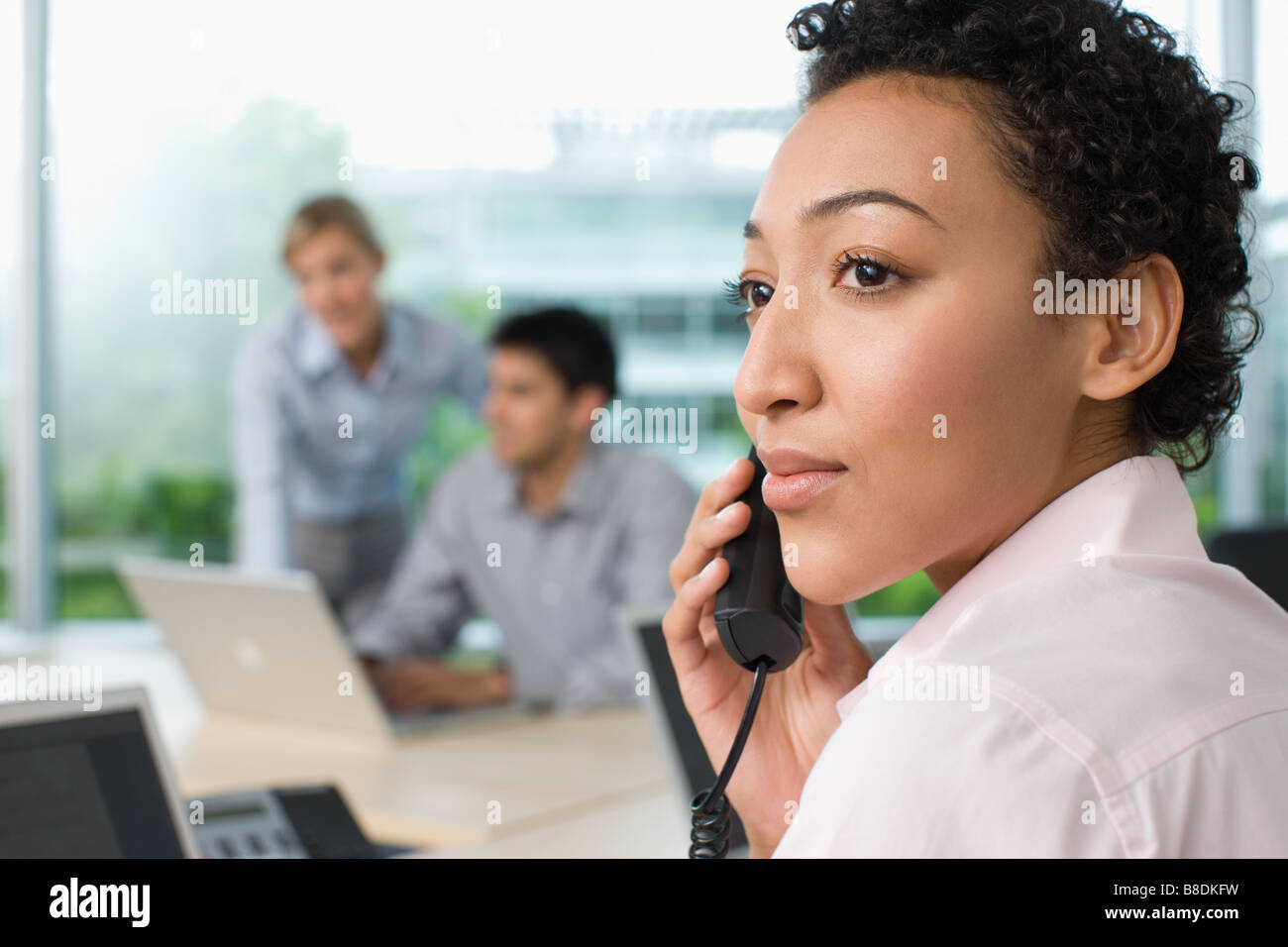 Office worker on telephone Stock Photo - Alamy