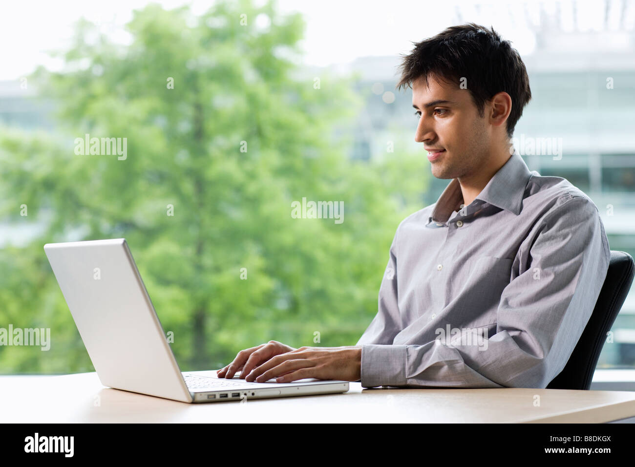 Office worker with laptop Stock Photo - Alamy
