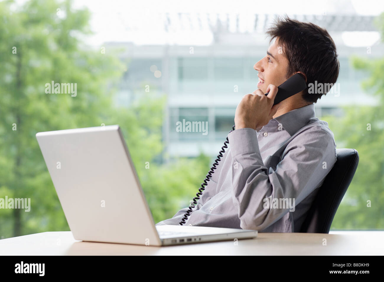 Office worker on telephone Stock Photo - Alamy