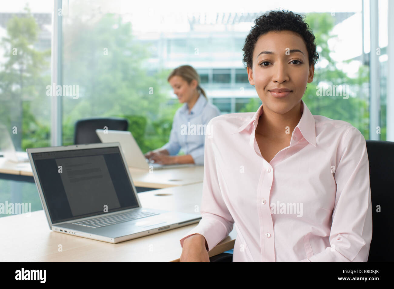 Woman in office Stock Photo - Alamy
