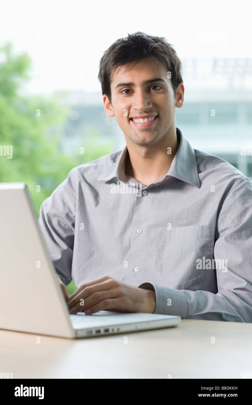 Office worker with laptop Stock Photo - Alamy