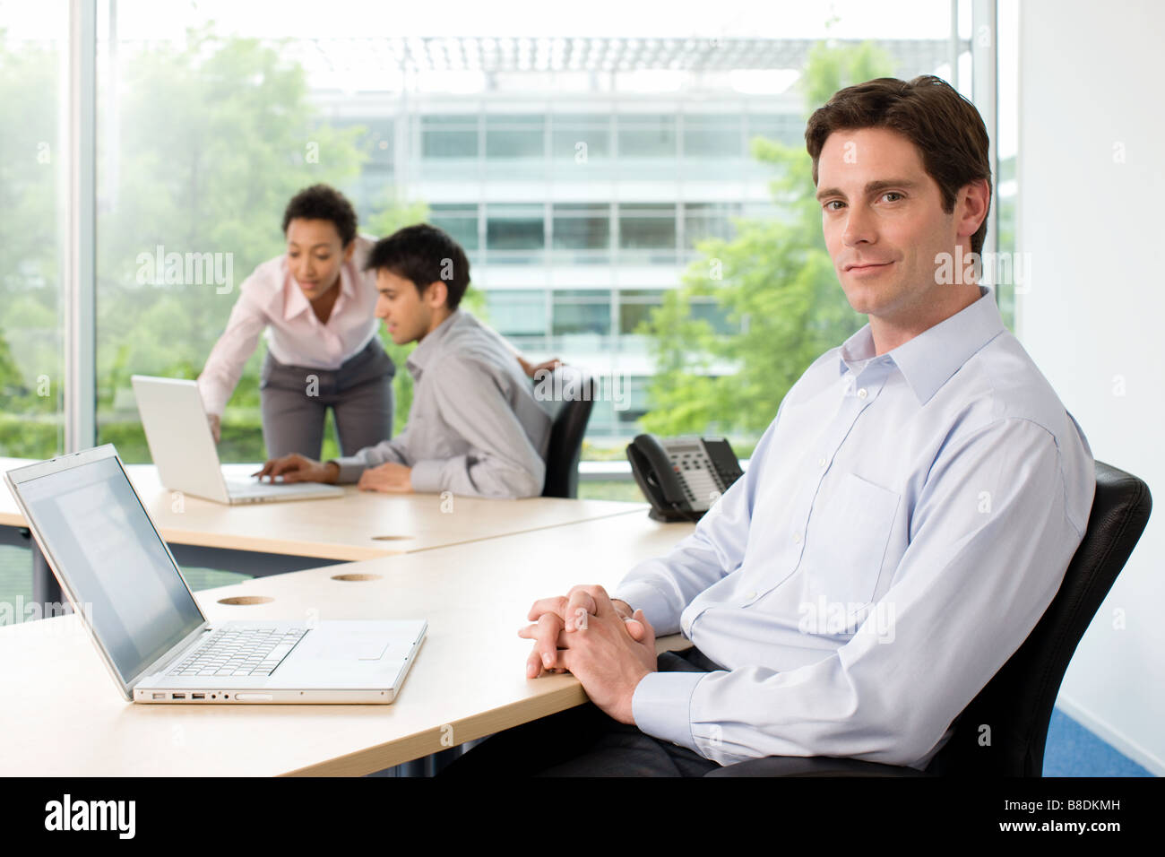 Office worker at desk Stock Photo - Alamy