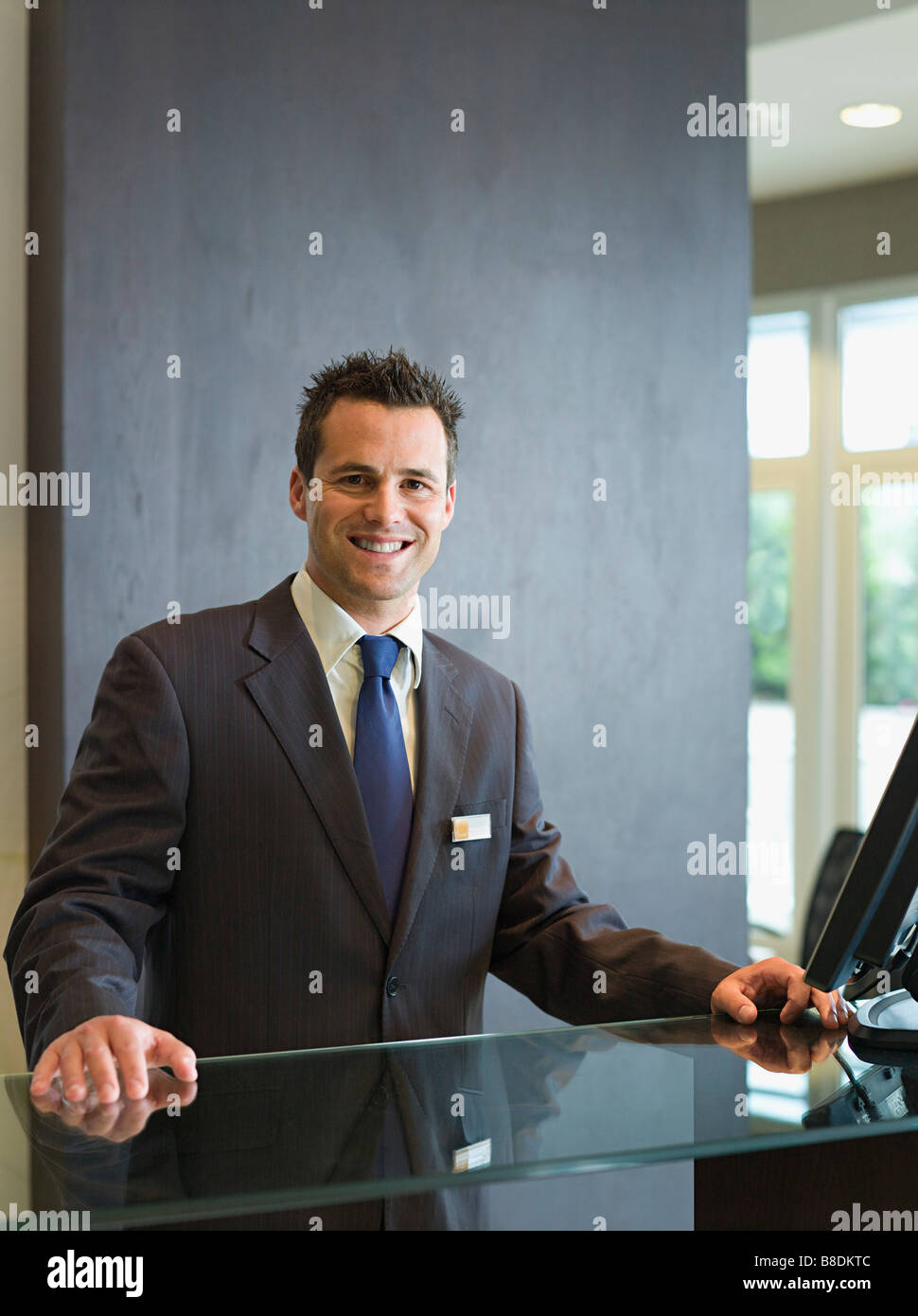 Man at a hotel reception Stock Photo - Alamy