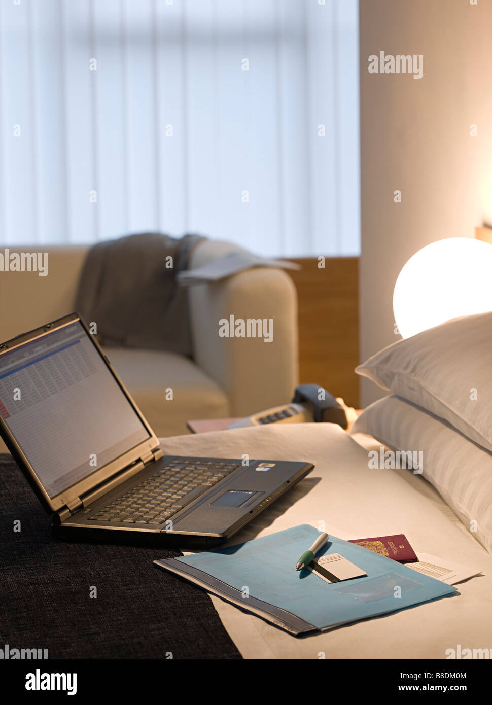Laptop computer on a hotel bed Stock Photo - Alamy