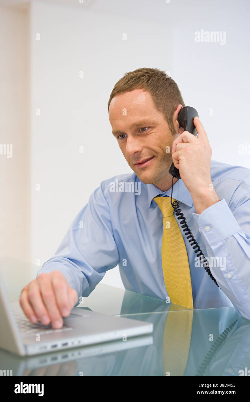 Office worker on telephone Stock Photo - Alamy