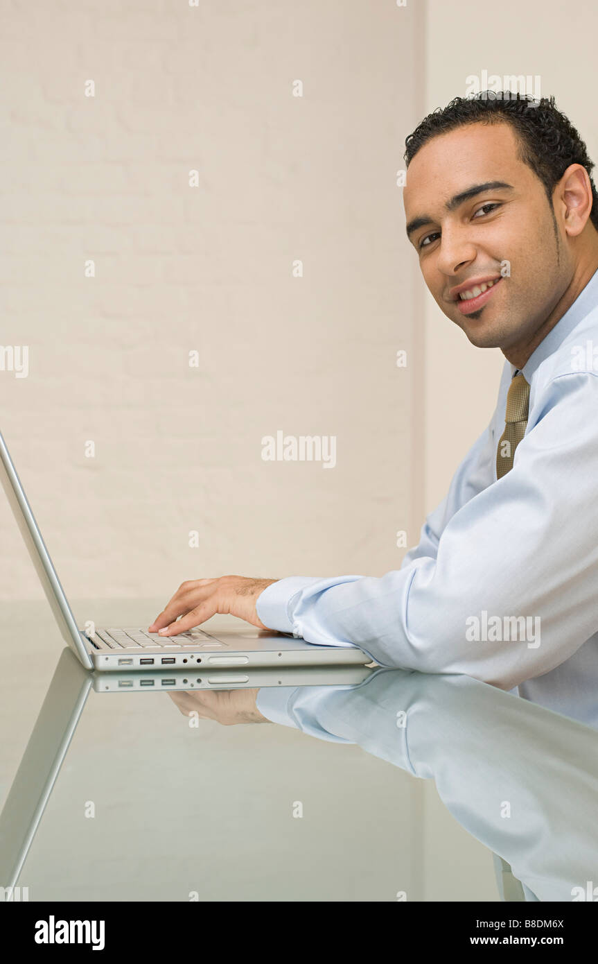 Office worker using laptop Stock Photo - Alamy