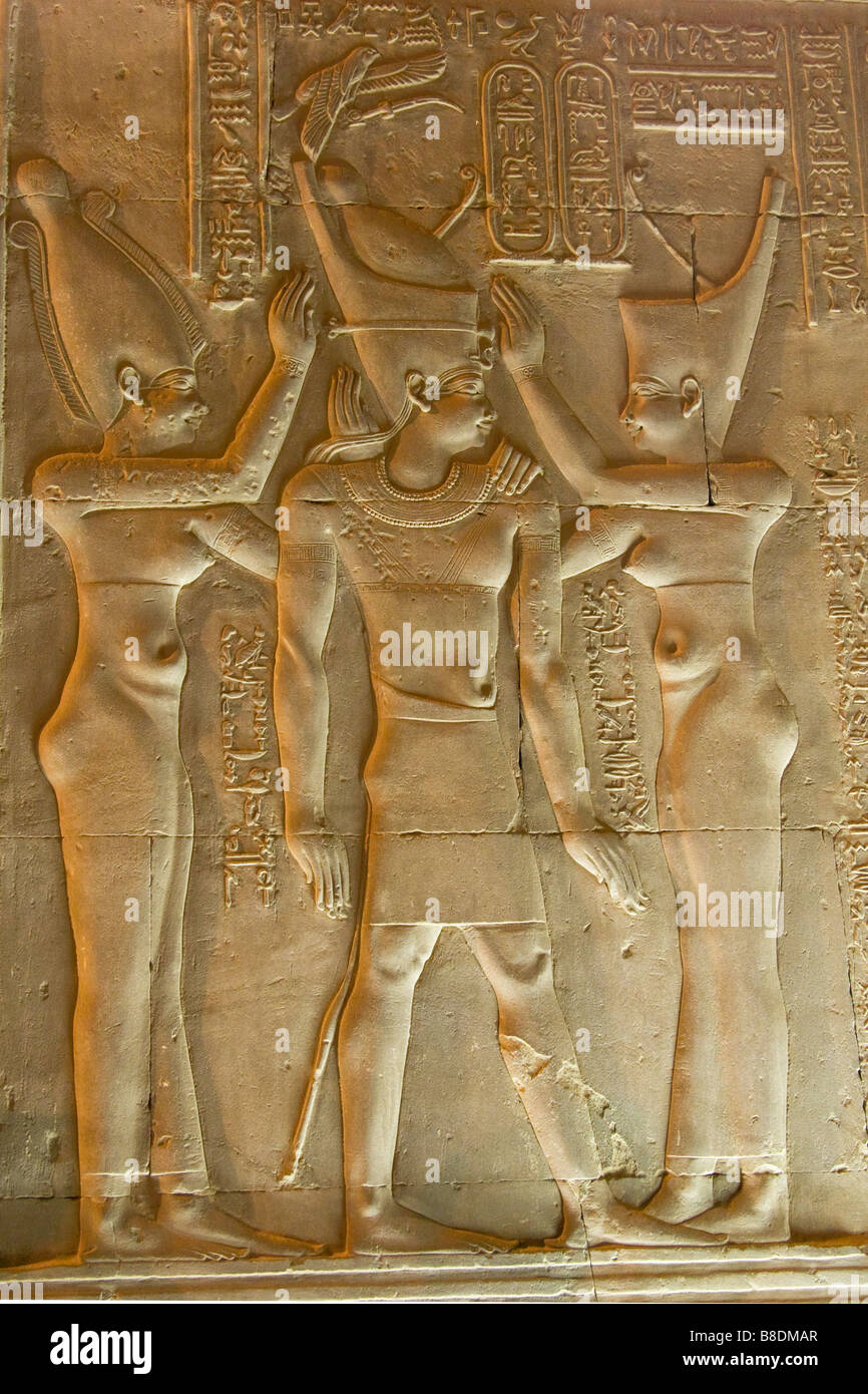 Engraved hieroglyphic figures on walls of temple in Egypt Stock Photo ...